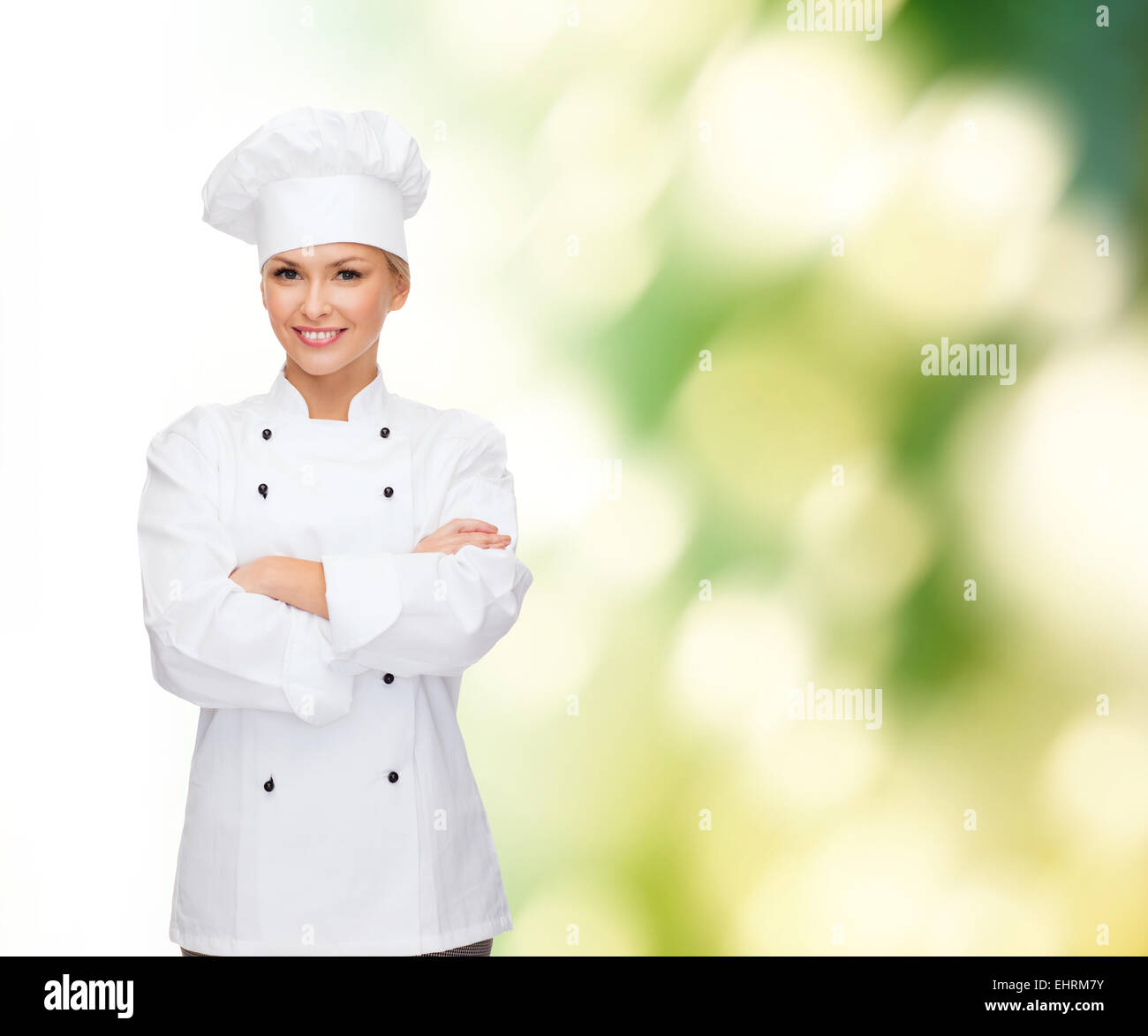 smiling female chef with crossed arms Stock Photo - Alamy