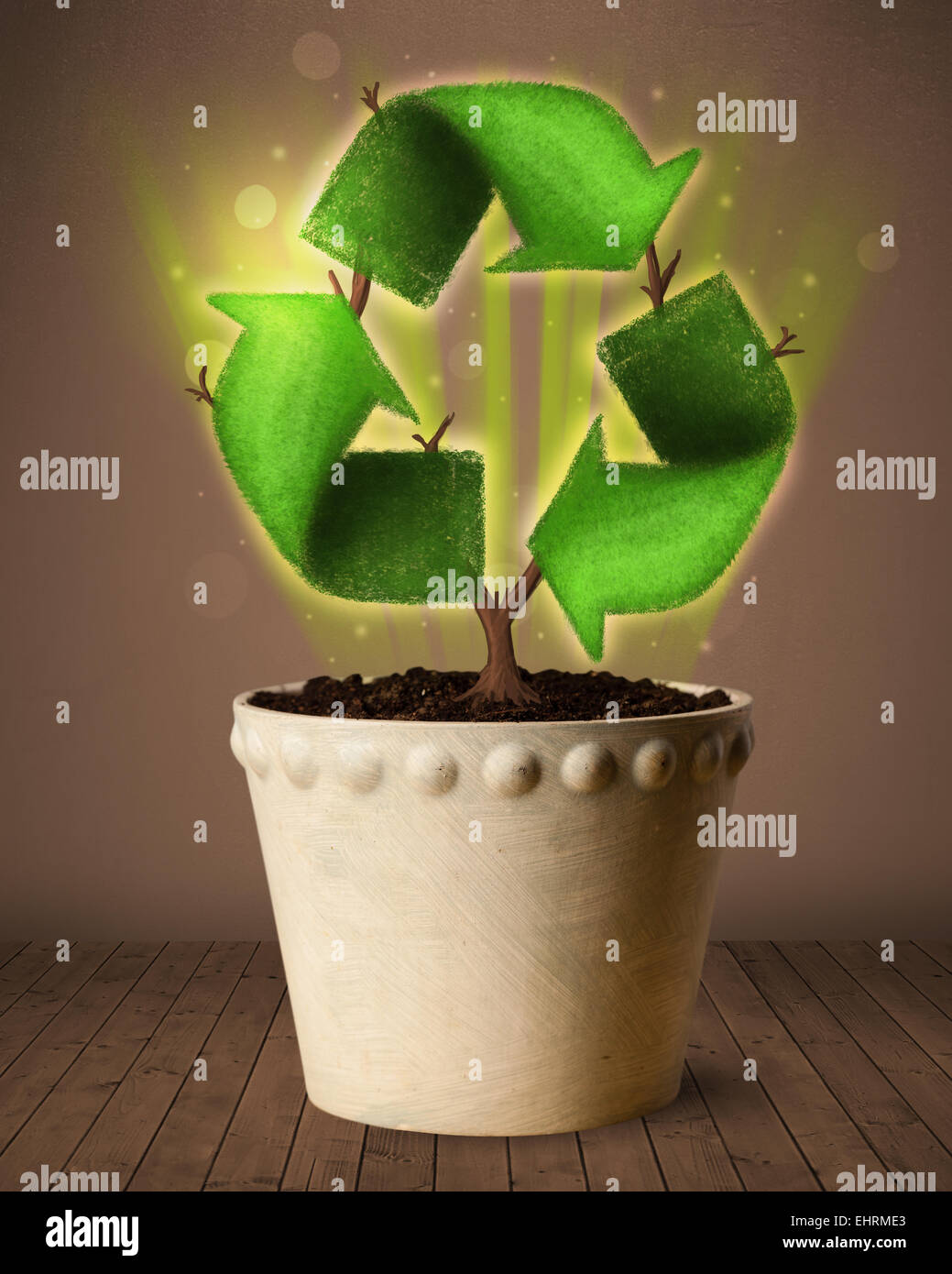 Recycle sign growing out of flowerpot Stock Photo - Alamy