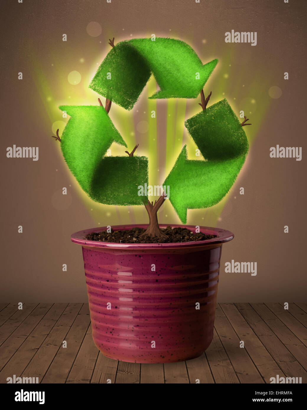 Recycle sign growing out of flowerpot Stock Photo - Alamy