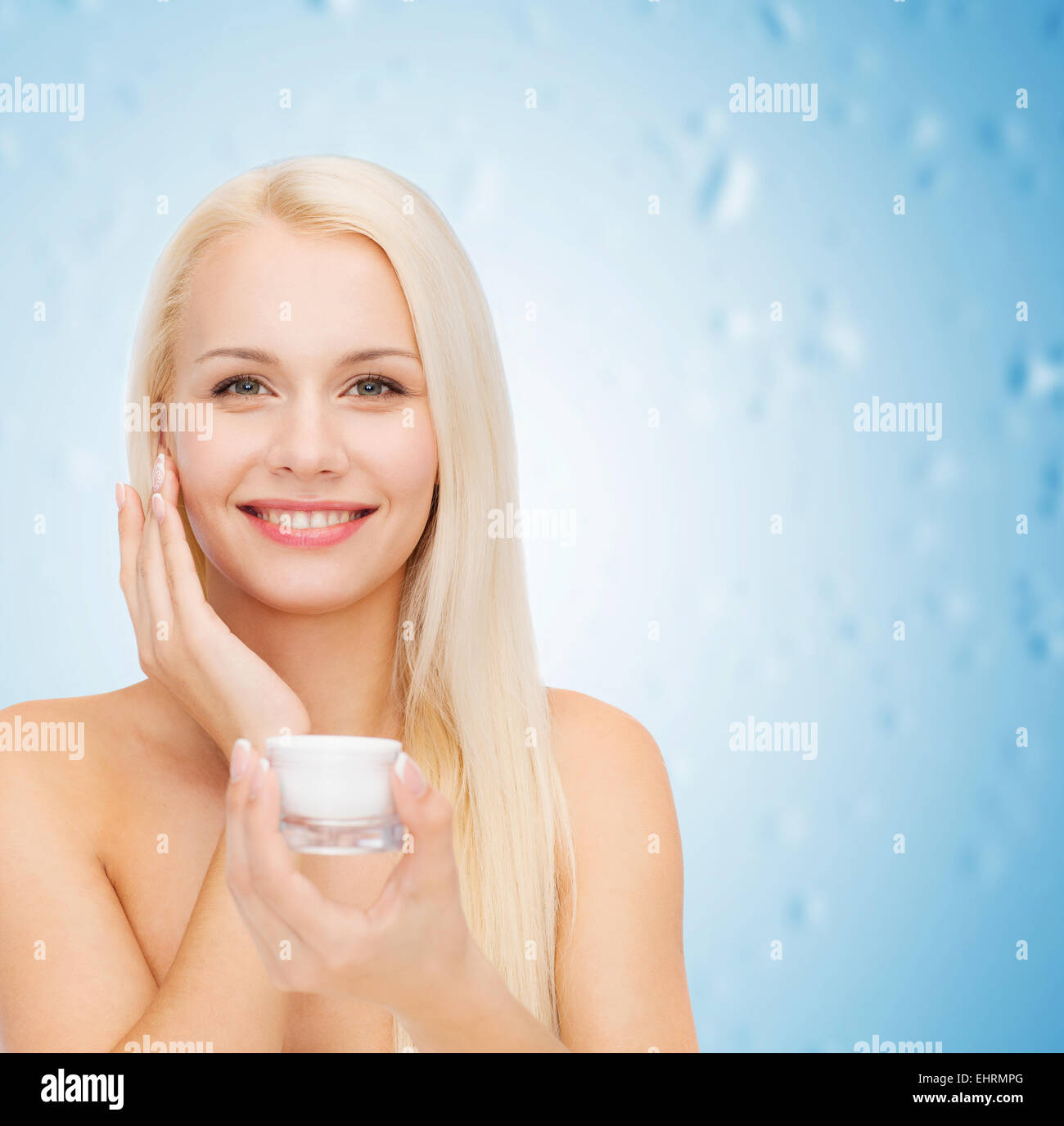woman applying cream on her skin Stock Photo - Alamy