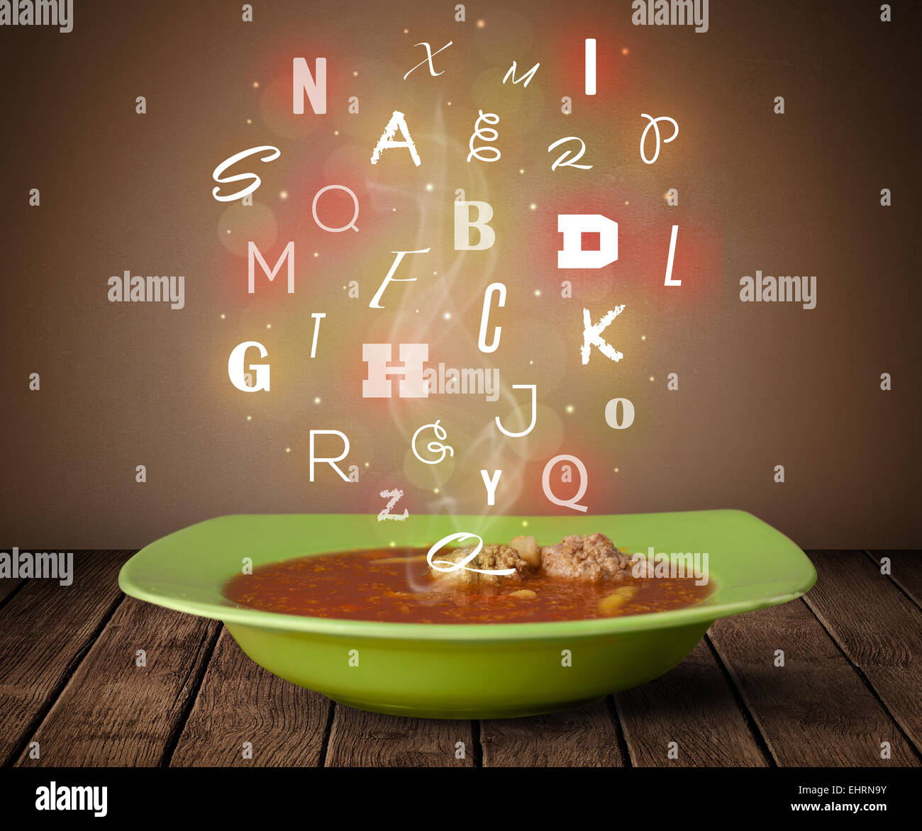 Colorful letters coming out of home cook soup bowl Stock Photo - Alamy