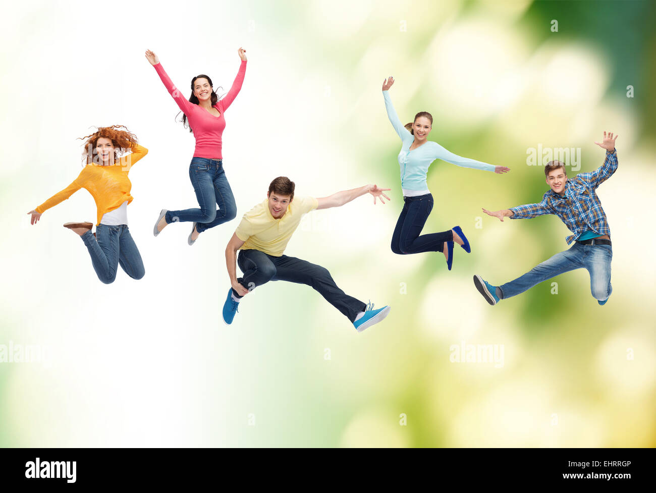 group of smiling teenagers jumping in air Stock Photo - Alamy