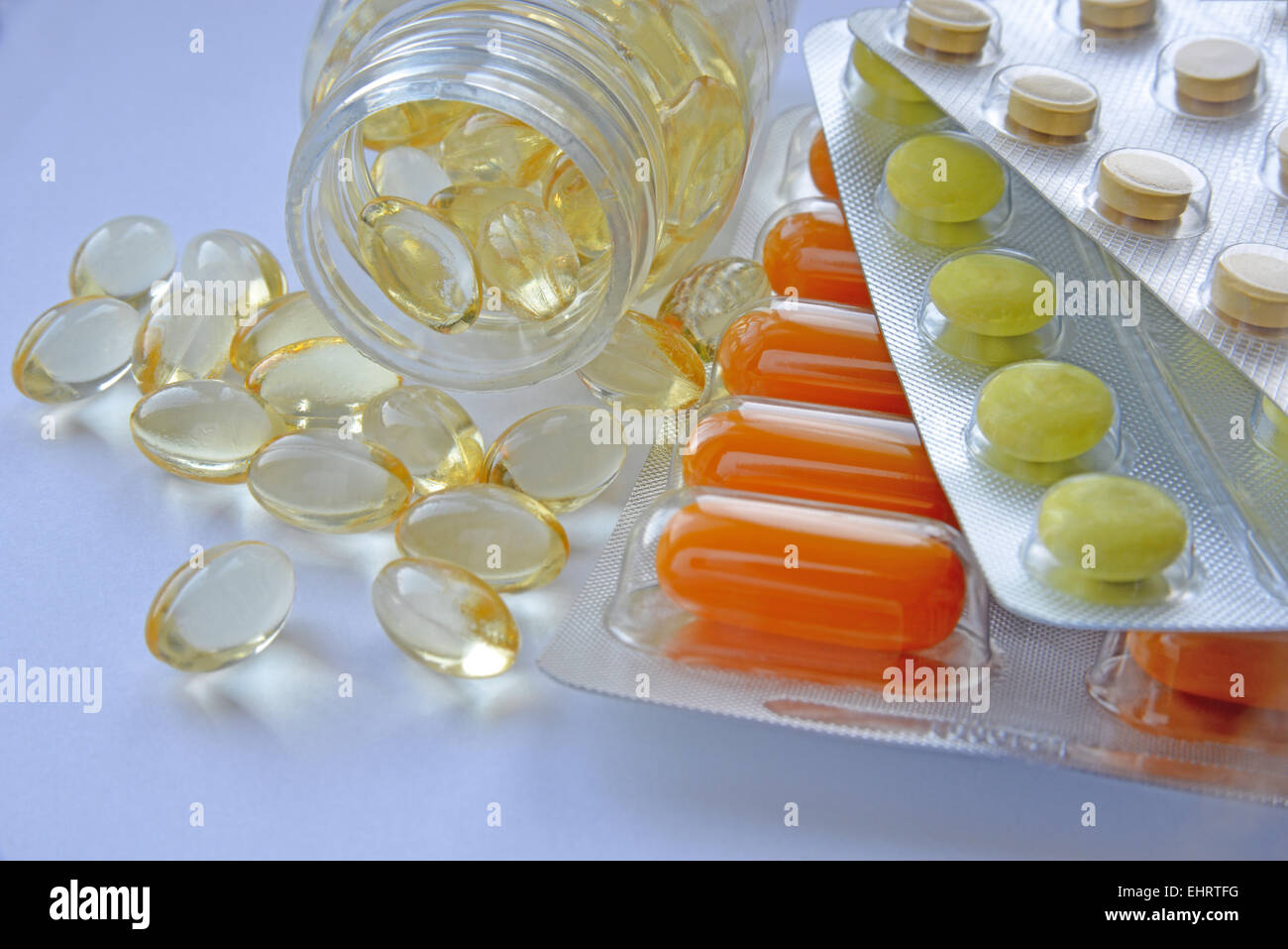 Many different pills are situated on the light surface Stock Photo - Alamy