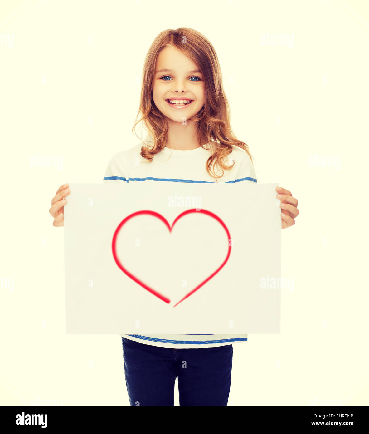 smiling little child holding picture of heart Stock Photo - Alamy