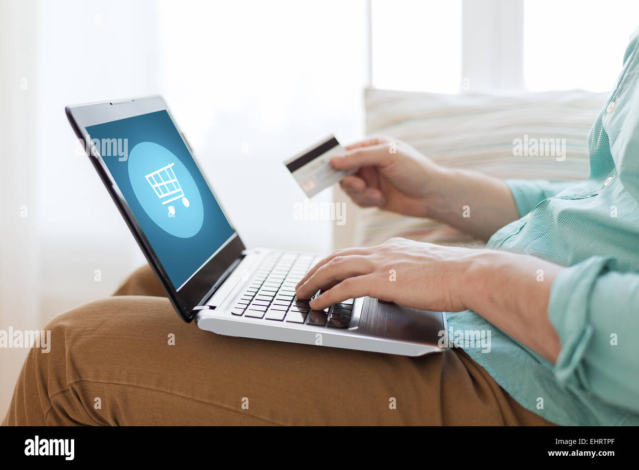 close up of man with laptop and credit card Stock Photo - Alamy