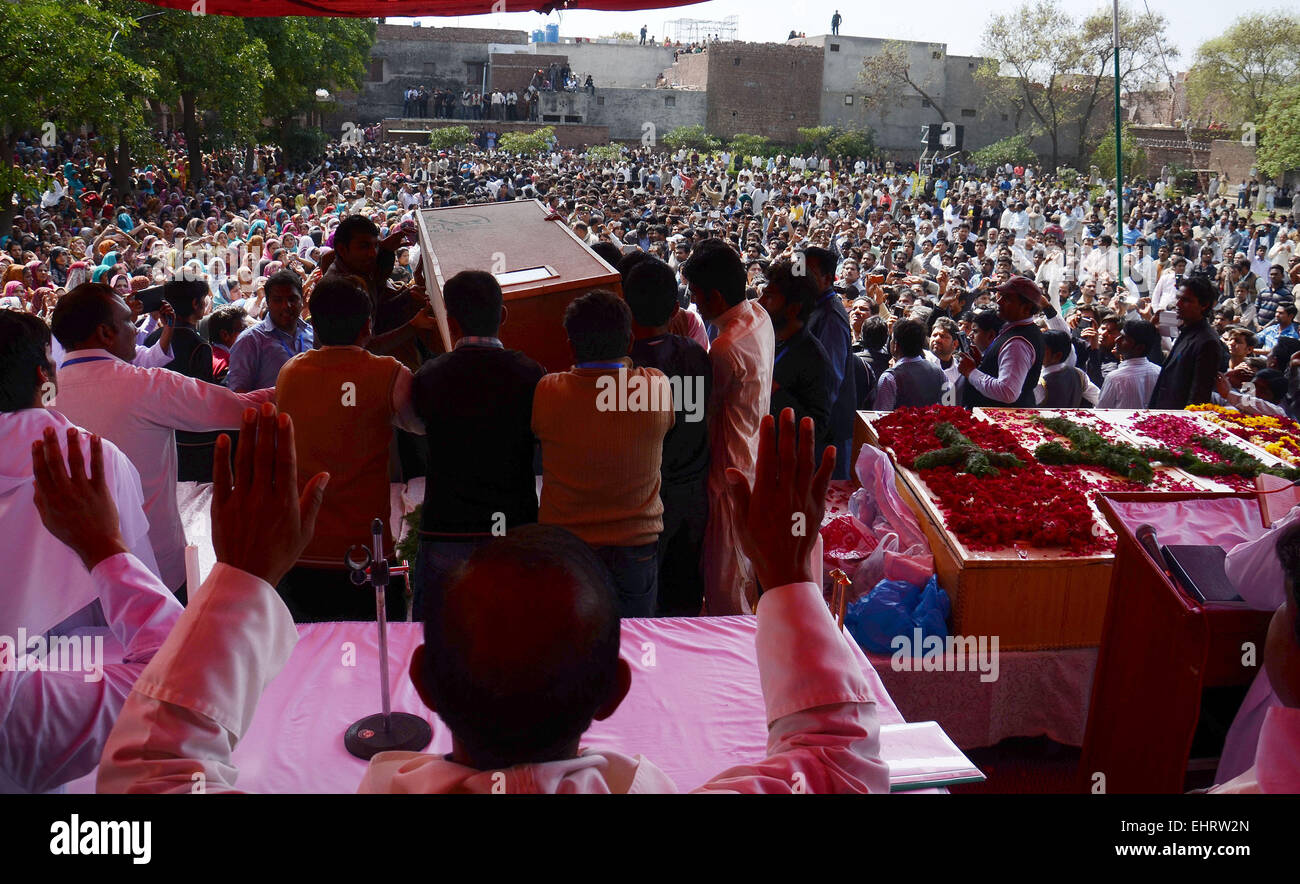 Pakistani Christian community carry the coffin of a victim during a ...