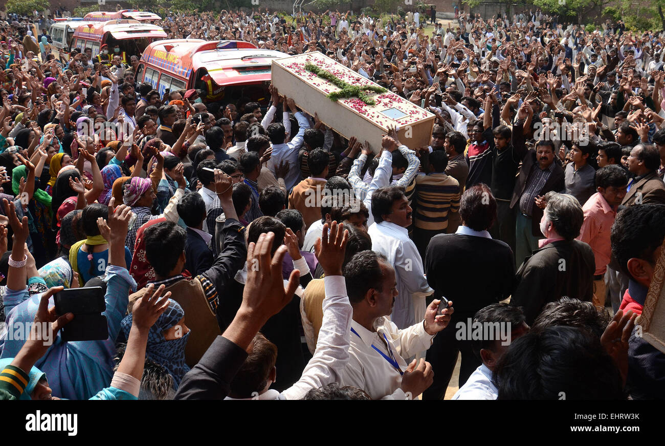 Pakistani Christian community carry the coffin of a victim during a ...