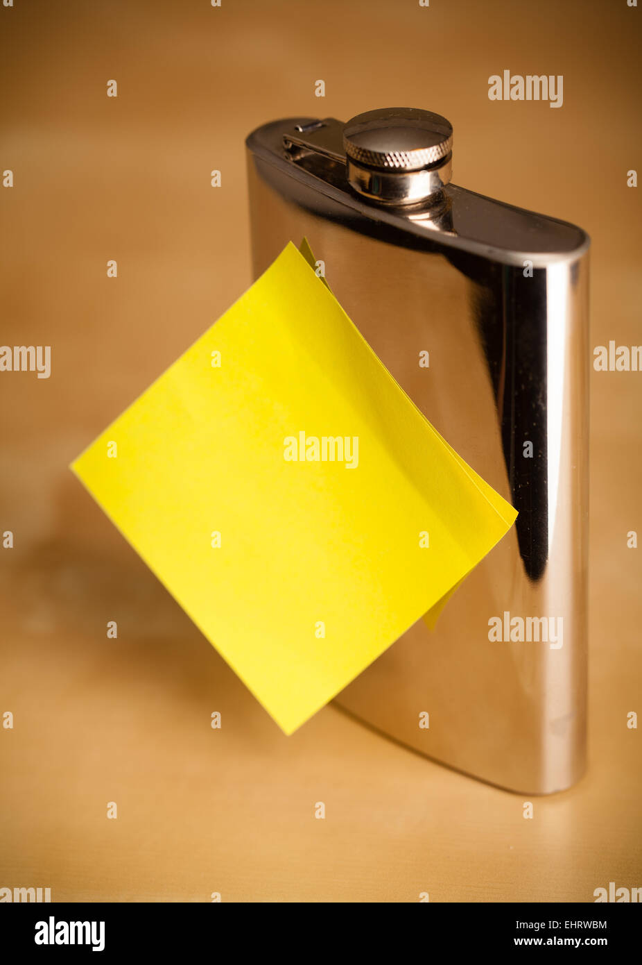 Empty post-it note sticked on hip flask Stock Photo - Alamy