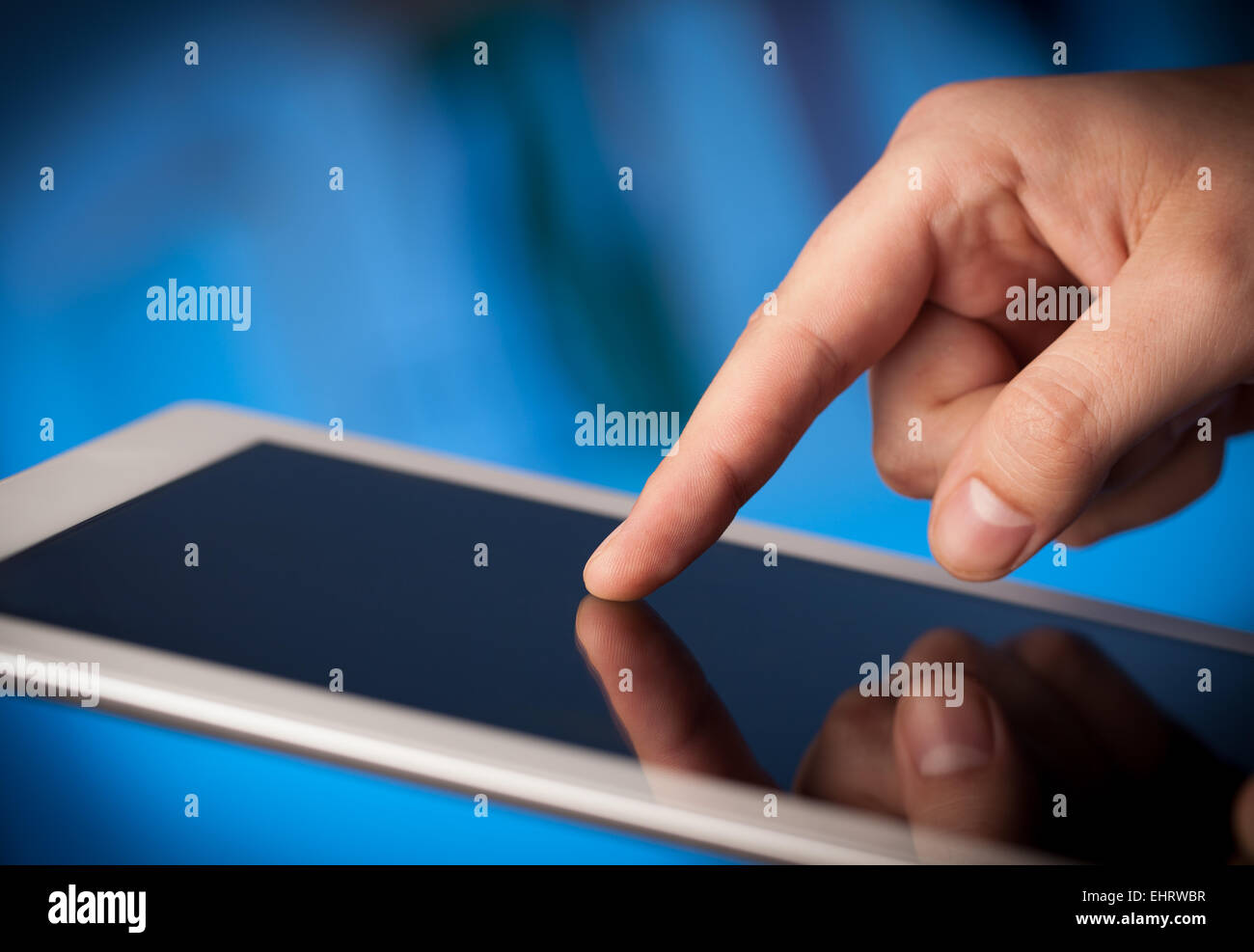 Finger pointing on tablet pc with empty space Stock Photo - Alamy