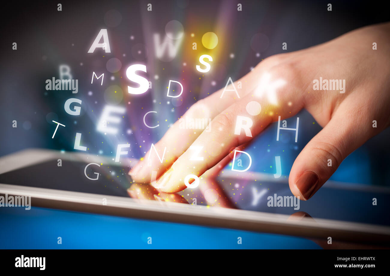 Finger pointing on tablet pc, letters concept Stock Photo - Alamy