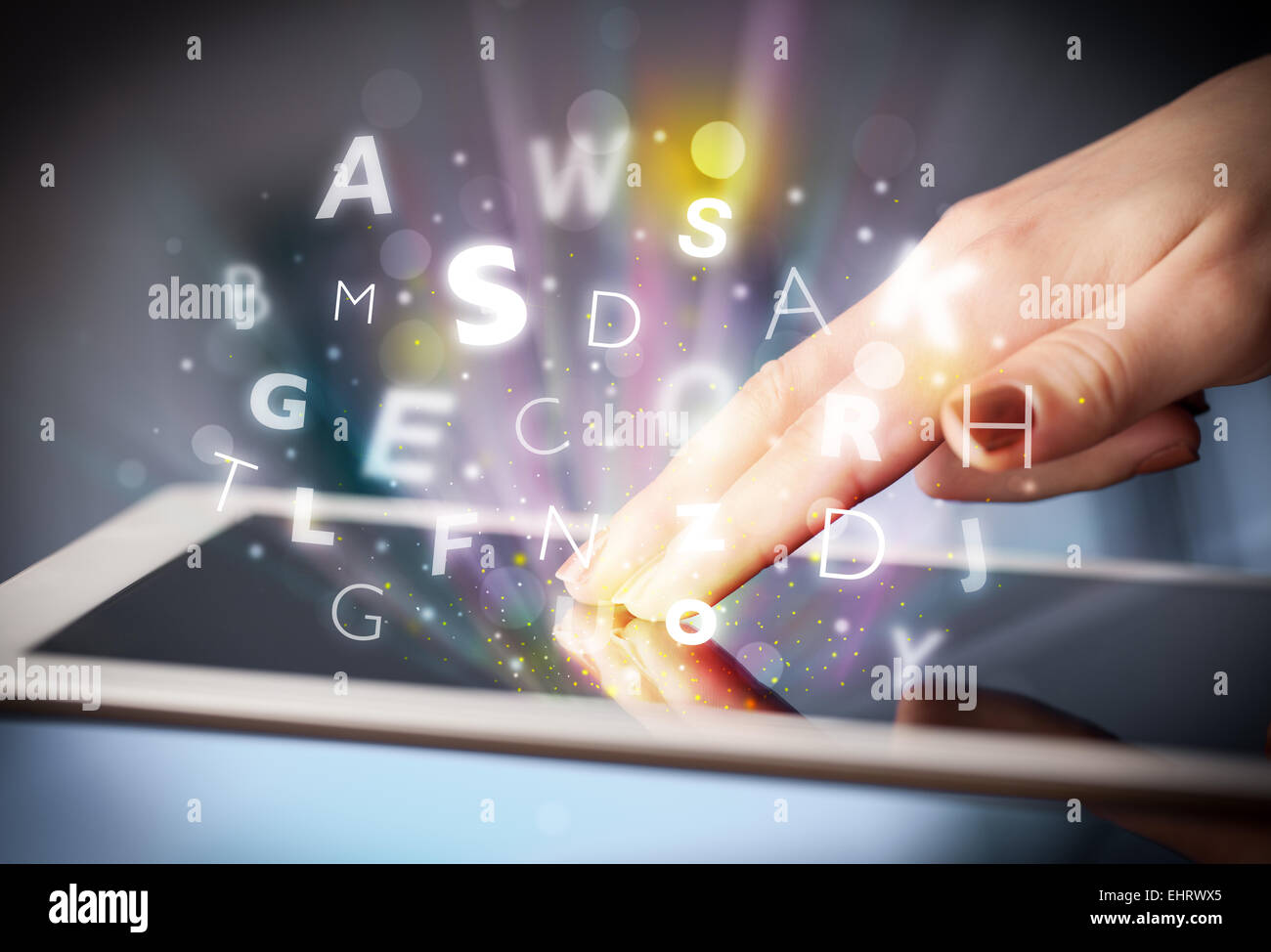 Finger pointing on tablet pc, letters concept Stock Photo - Alamy