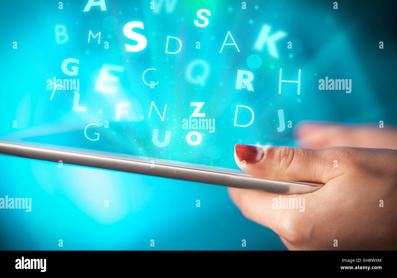 Finger pointing on tablet pc, letters concept Stock Photo - Alamy
