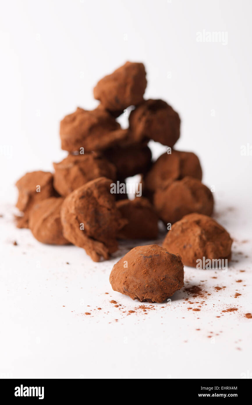 A small pile of chocolate truffles on a plain white background Stock ...
