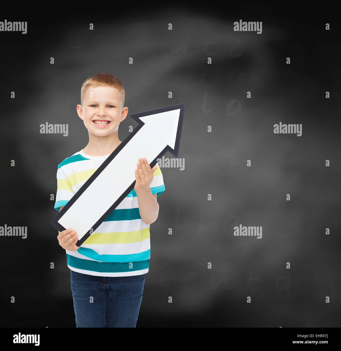 smiling little boy with blank arrow pointing right Stock Photo - Alamy