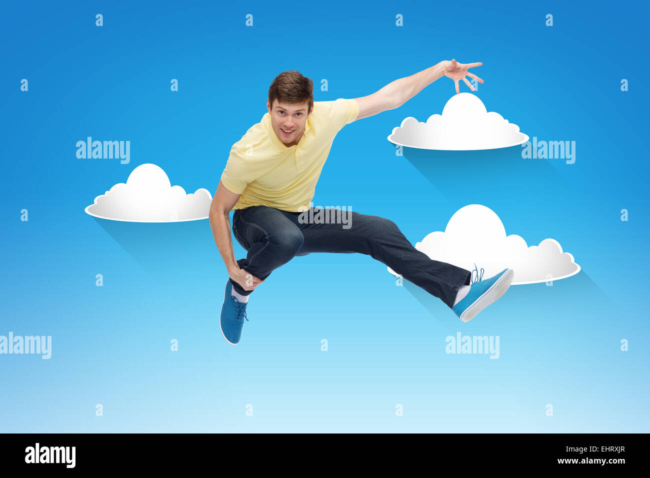 smiling young man jumping in air Stock Photo - Alamy