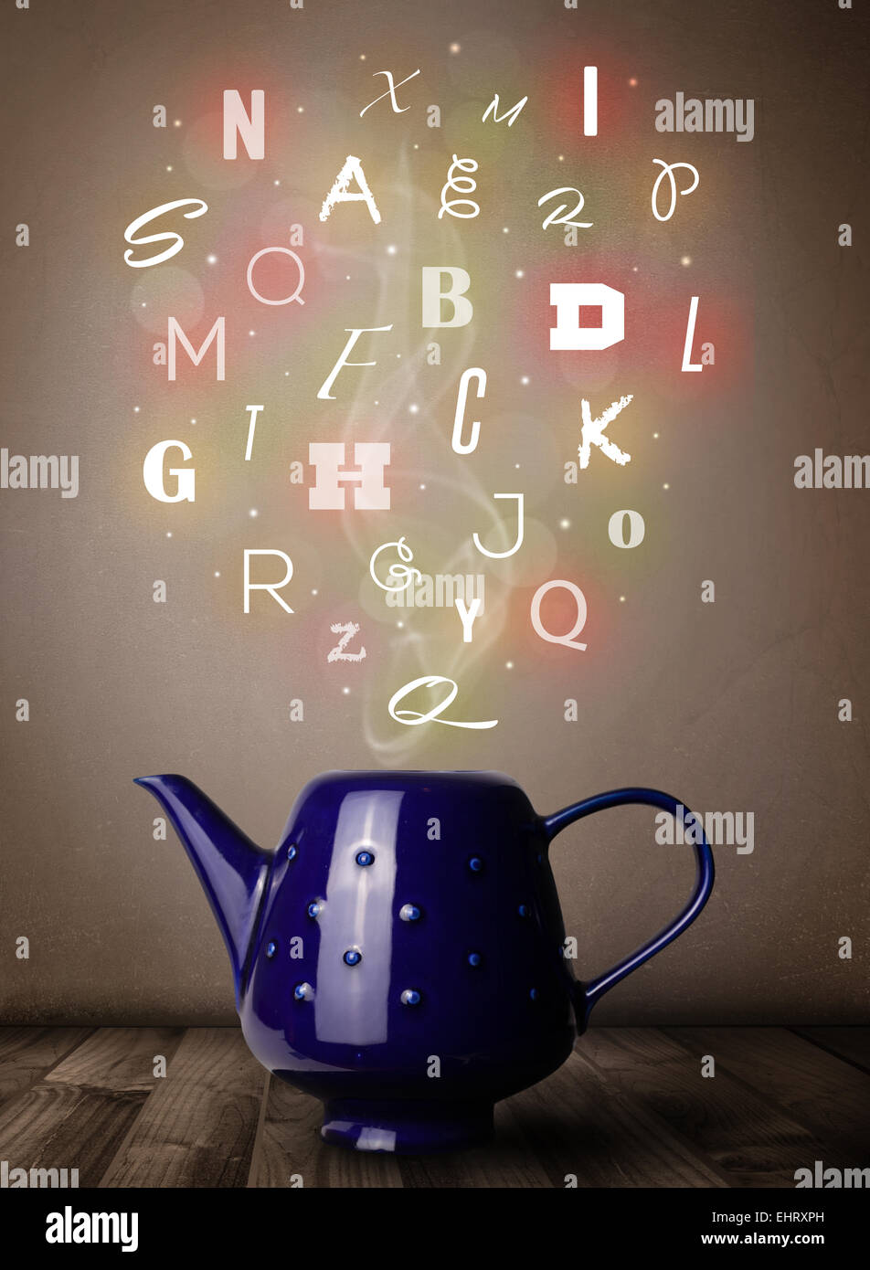 Tea pot with colorful letters Stock Photo - Alamy