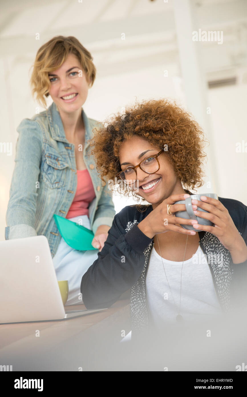 Portrait of two smiling office workers Stock Photo - Alamy