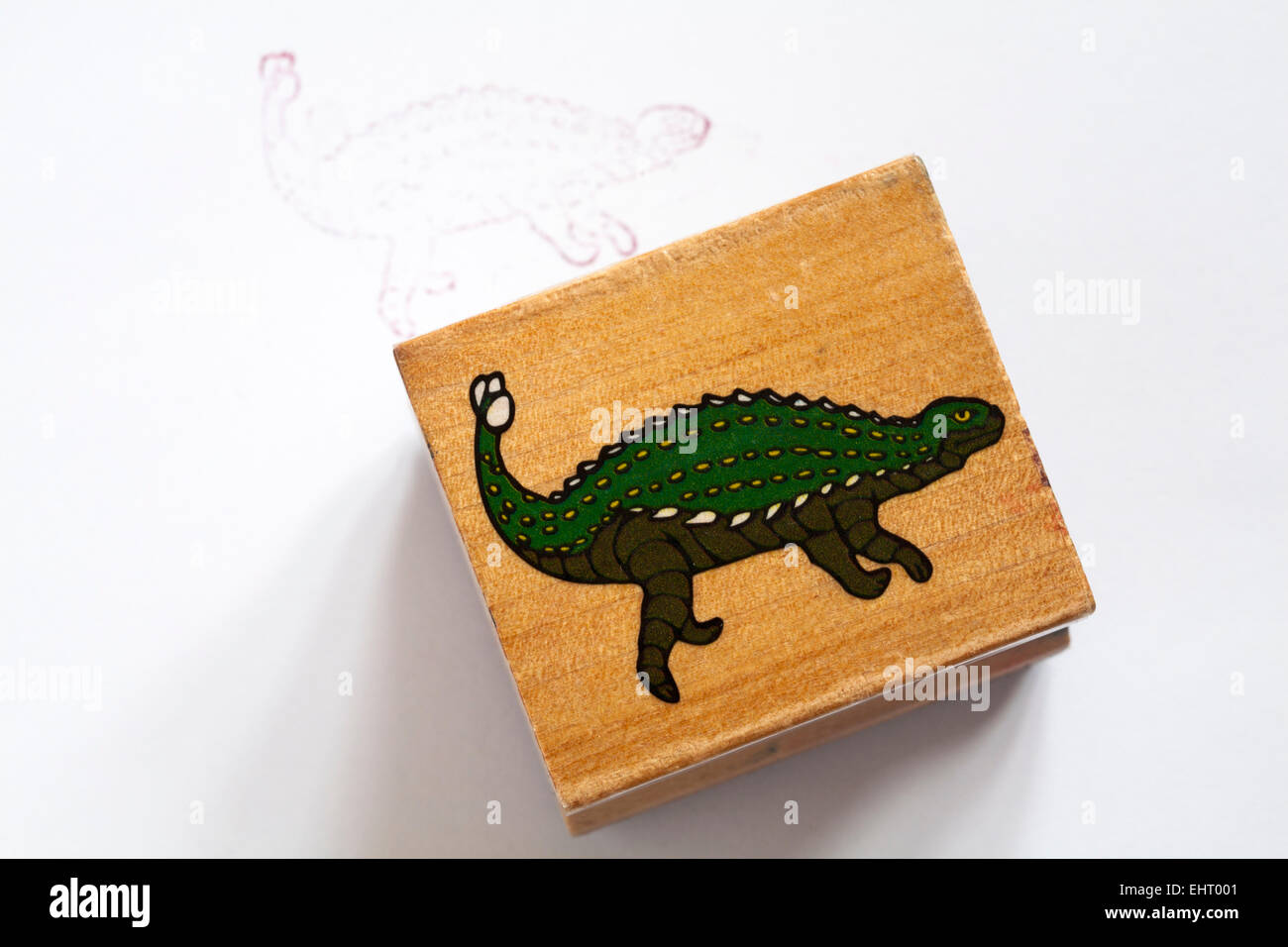 Dinosaur stamp with faint outline of ink stamped on white paper Stock ...