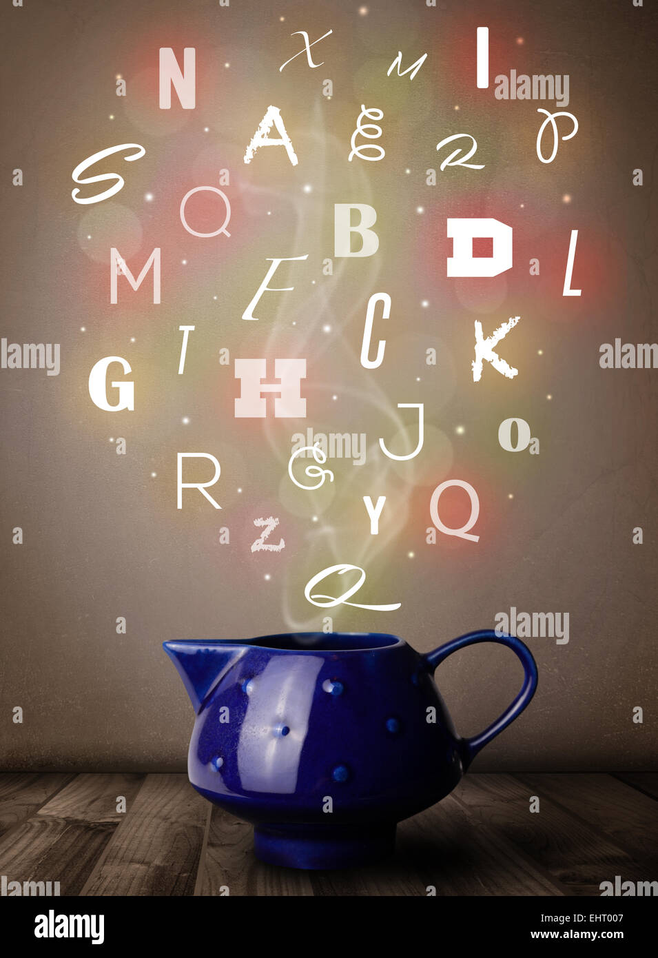 Tea pot with colorful letters Stock Photo - Alamy