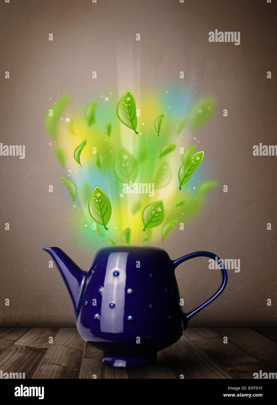 Tea pot with leaves and colorful abstract lights Stock Photo - Alamy