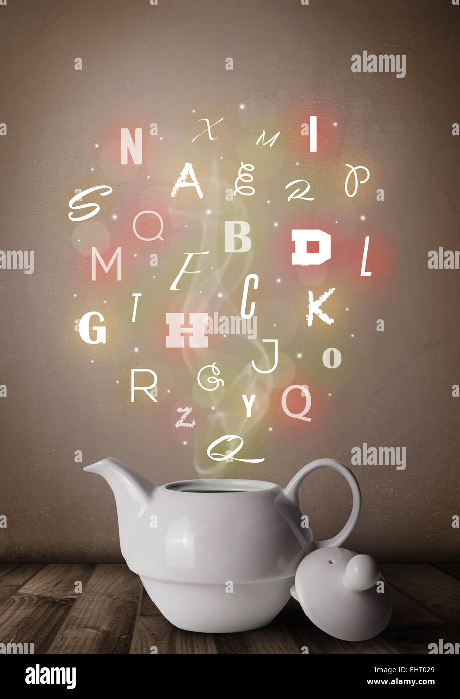 Tea pot with colorful letters Stock Photo - Alamy