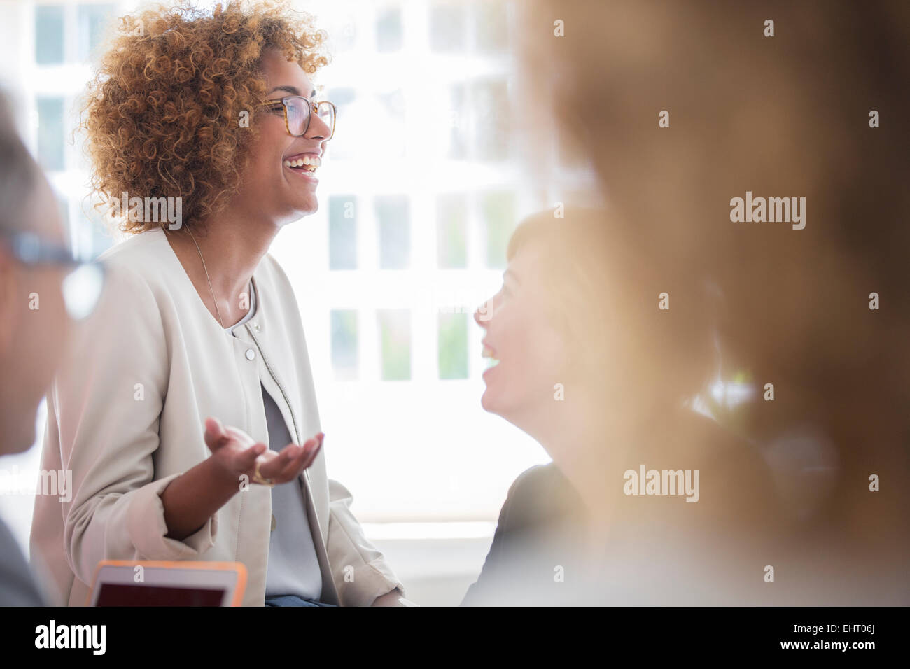 Office workers talking at meeting Stock Photo - Alamy