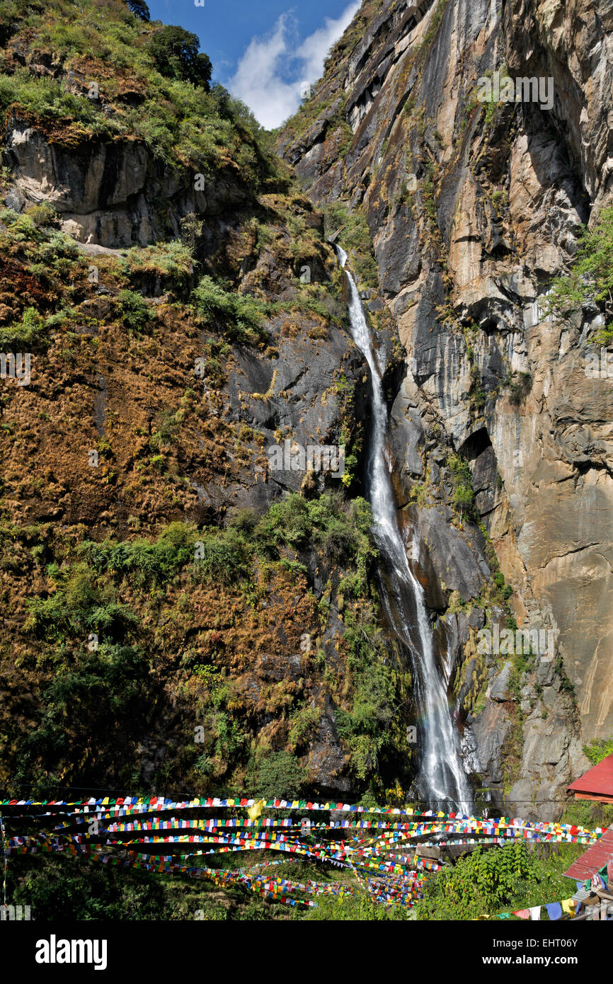 BHUTAN -Prayer flags by a waterfall near entrance to Taktshang Goemba ...