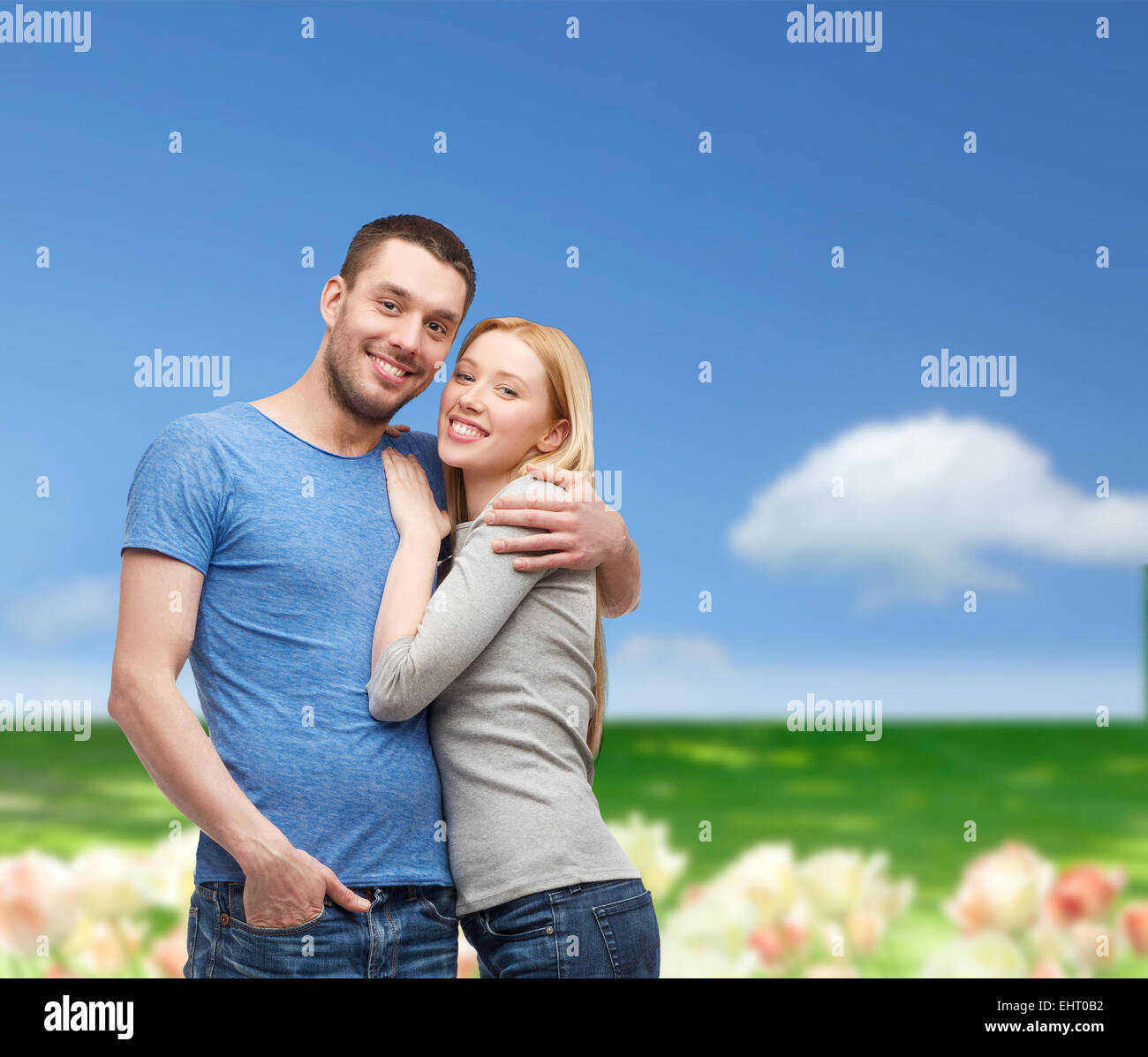 smiling couple hugging Stock Photo - Alamy