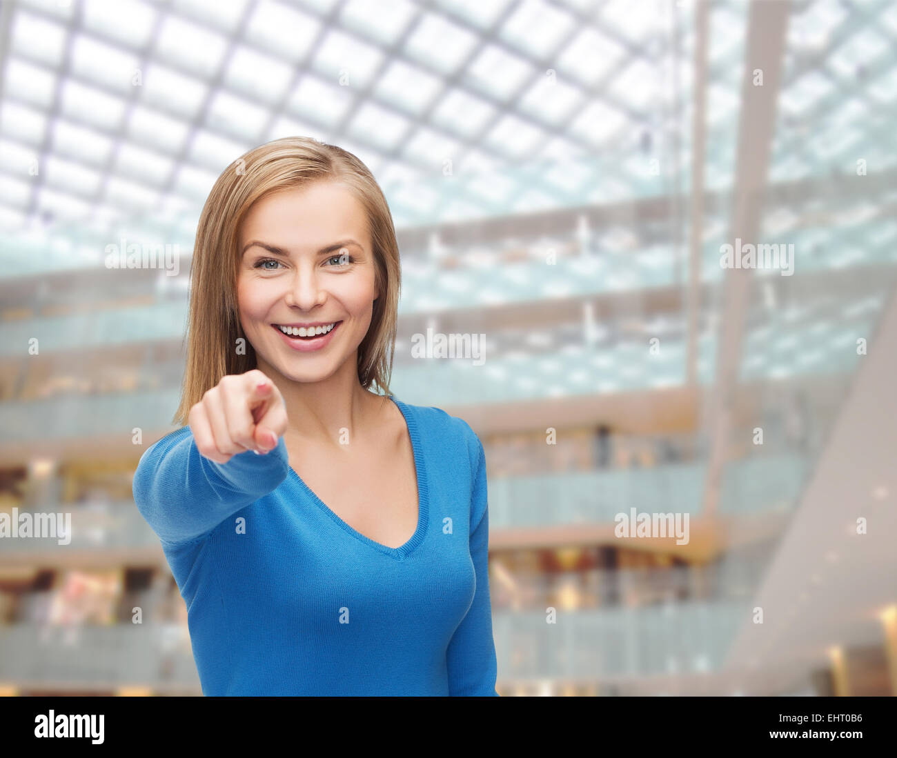 smiling student pointing finger at you Stock Photo - Alamy