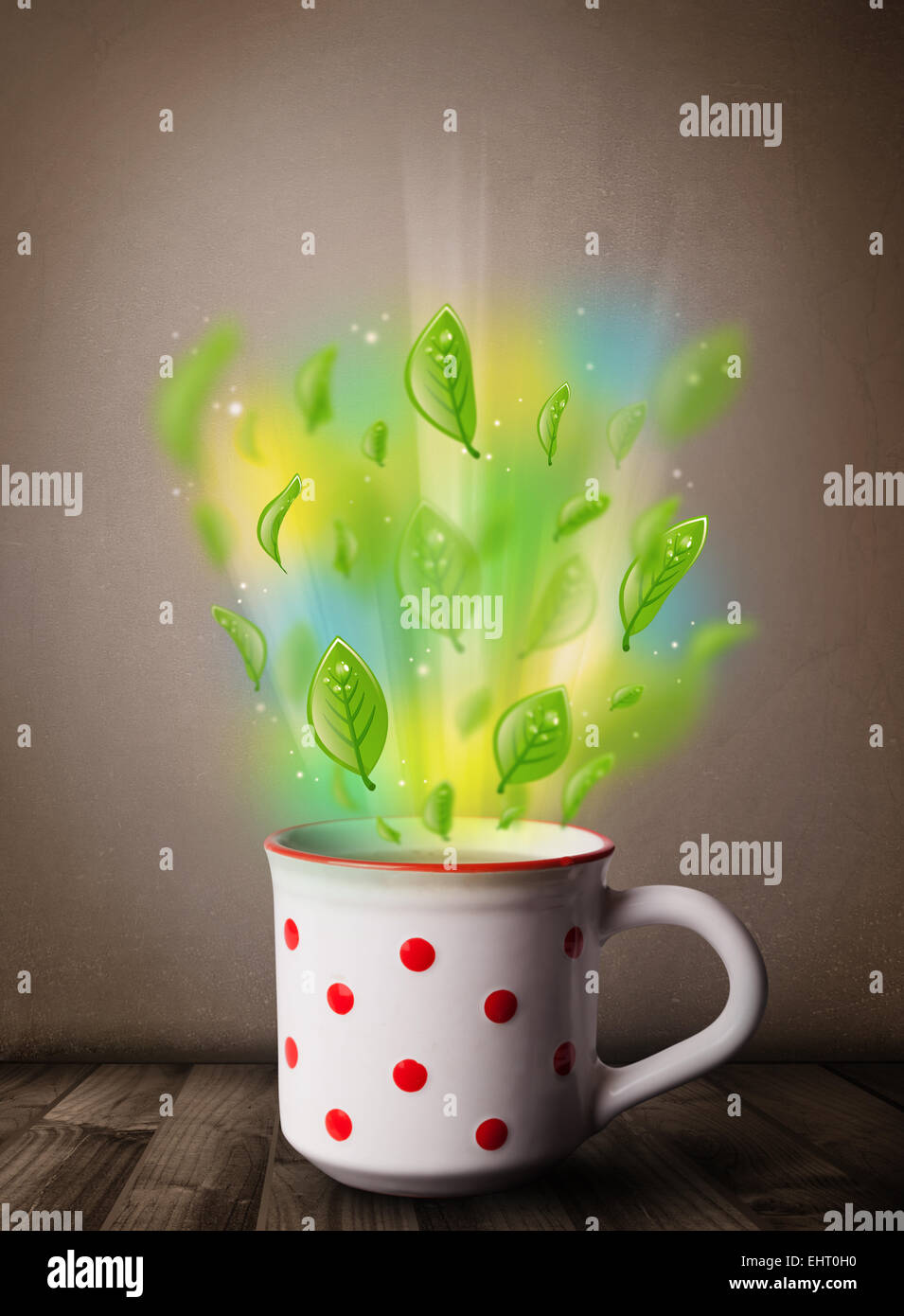Tea cup with leaves and colorful abstract lights Stock Photo - Alamy