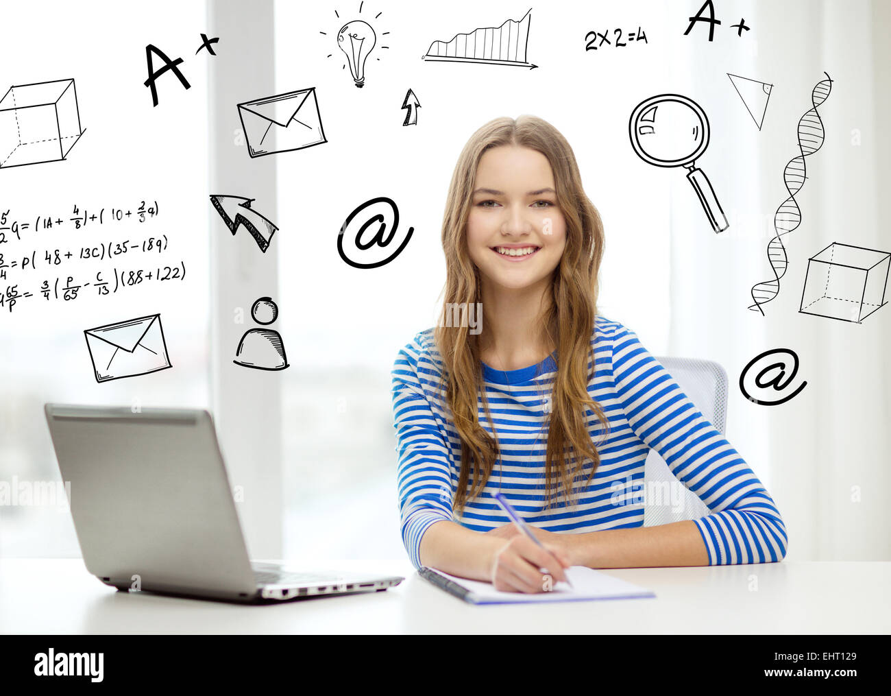 smiling teenage girl laptop computer and notebook Stock Photo - Alamy