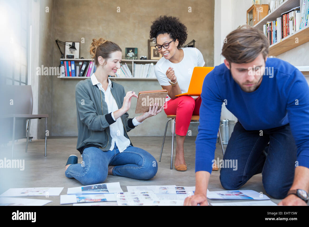 Three young people working together in studio Stock Photo - Alamy