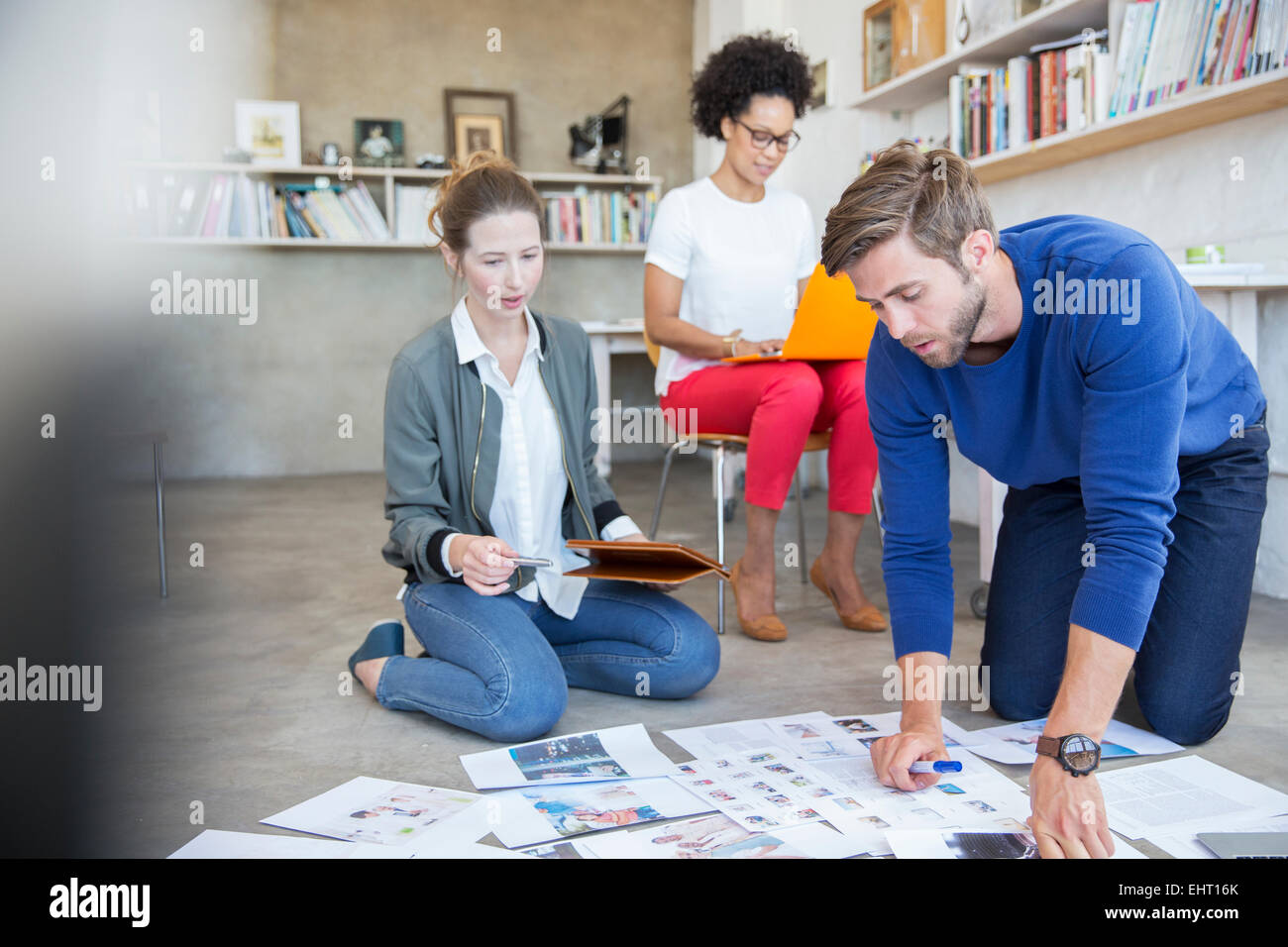 Three young people working together in studio Stock Photo - Alamy