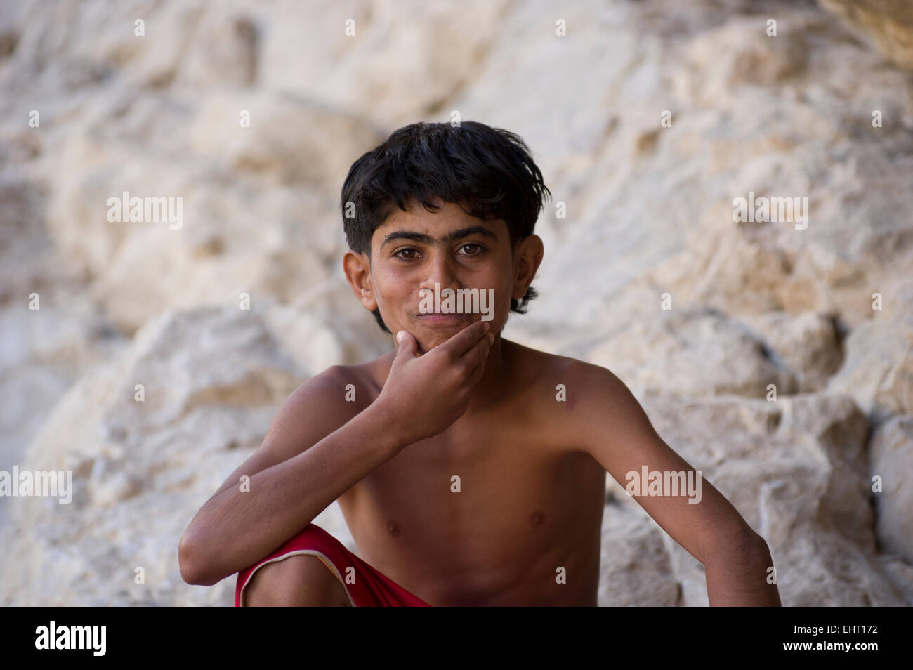 Confident boy facing the camera with a friendly and open expression ...