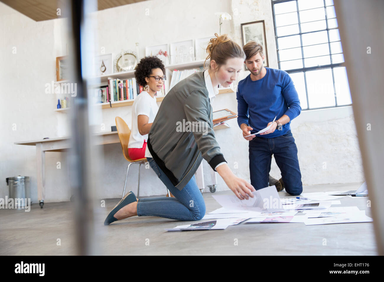 Three young people working together in studio Stock Photo - Alamy