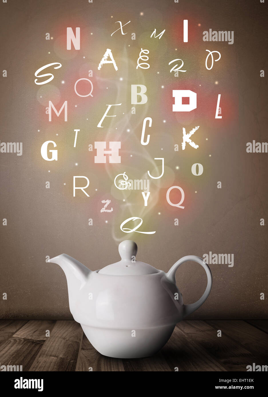 Tea pot with colorful letters Stock Photo - Alamy