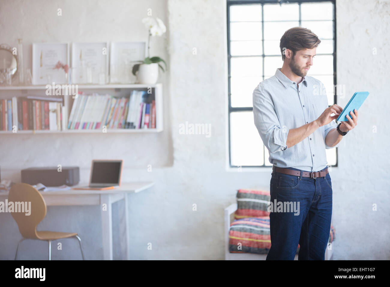 30 year old man standing with tablet hi-res stock photography and ...