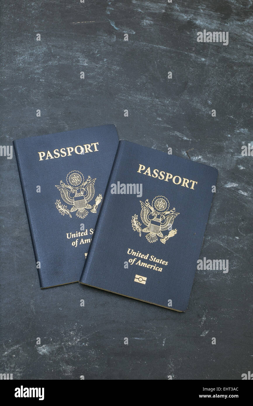 Two Us Passports On Black Background American Citizenship Traveling Around The World Stock