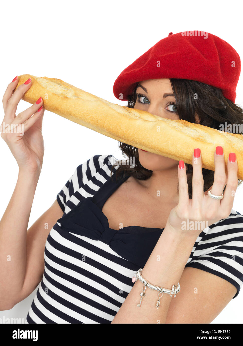 Confident Happy Young Woman Wearing A Red Beret And Striped Top Holding ...