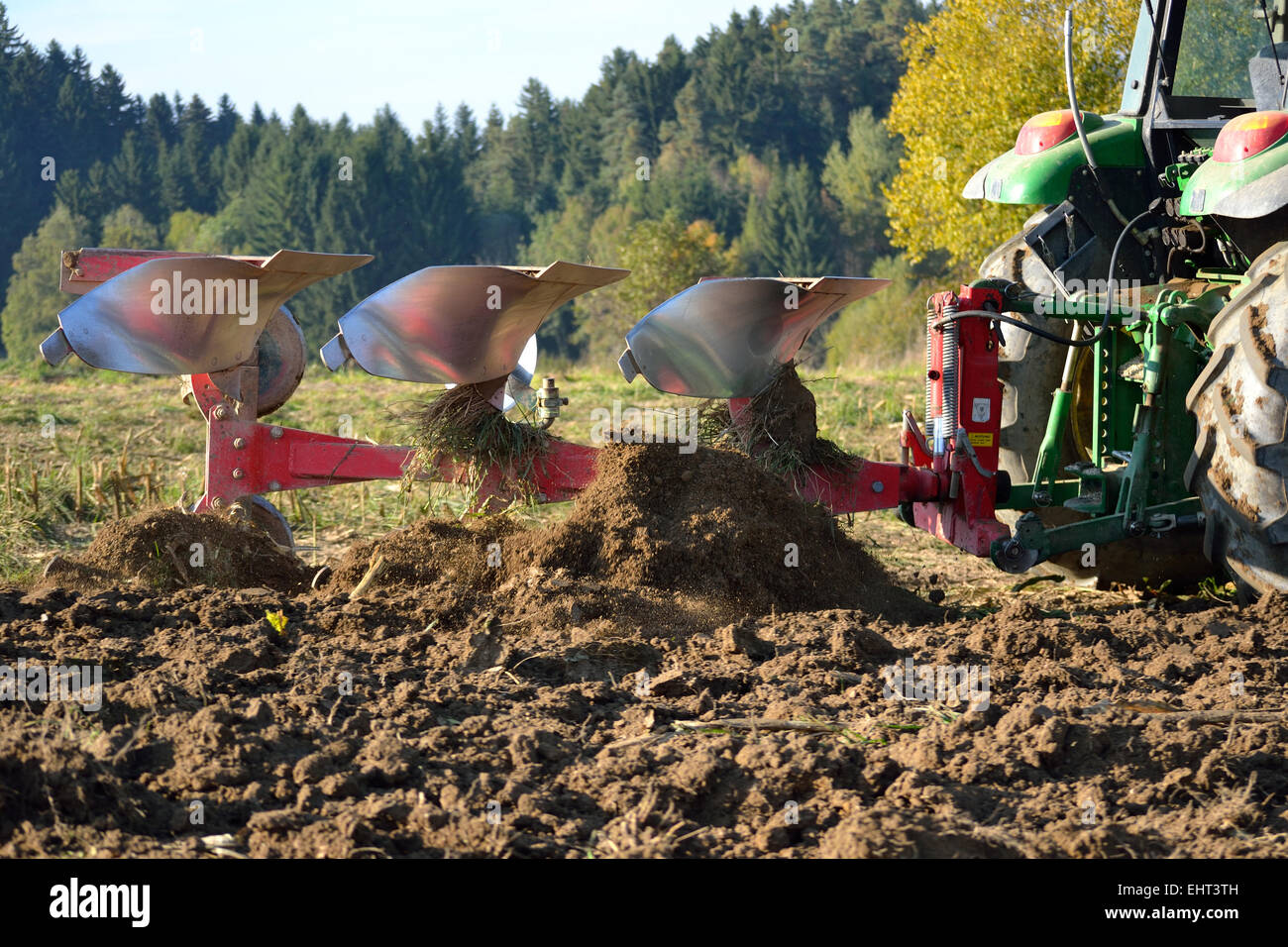 Farmer plowing his field Stock Photo - Alamy