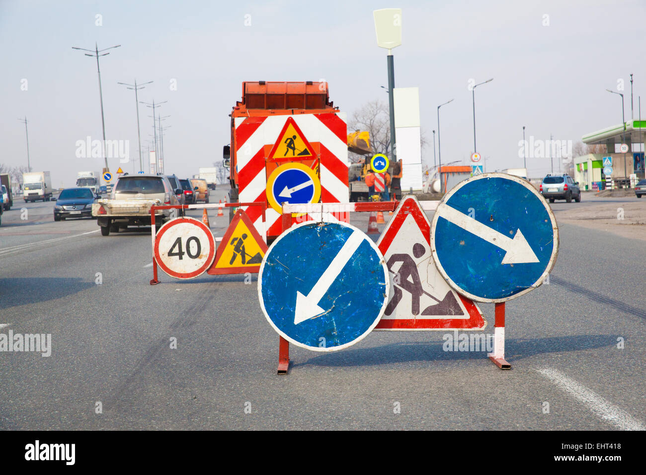 Road works: signs on the lane to warn the drivers of the lane in ...