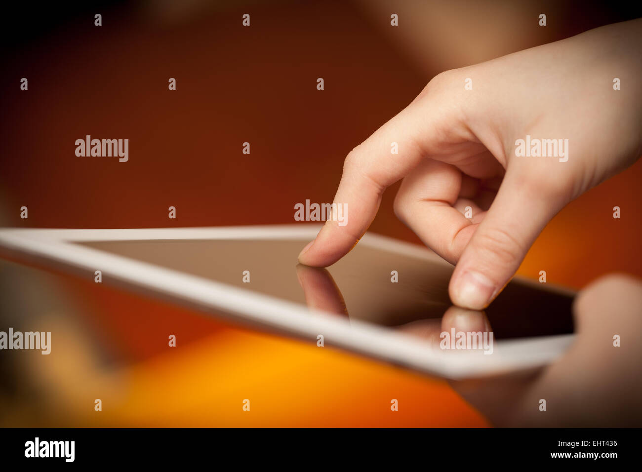 Finger pointing on tablet pc with empty space Stock Photo - Alamy