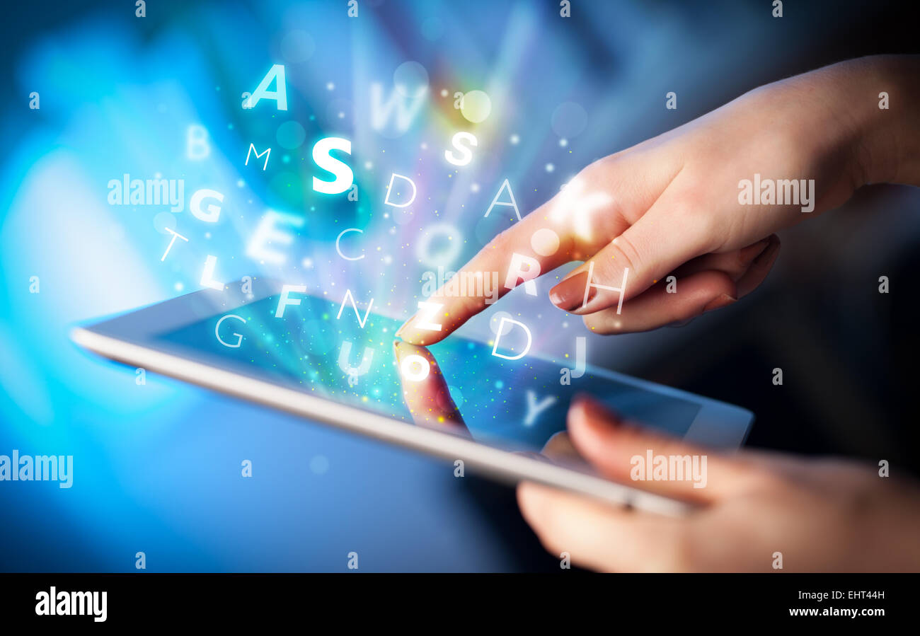 Finger pointing on tablet pc, letters concept Stock Photo - Alamy