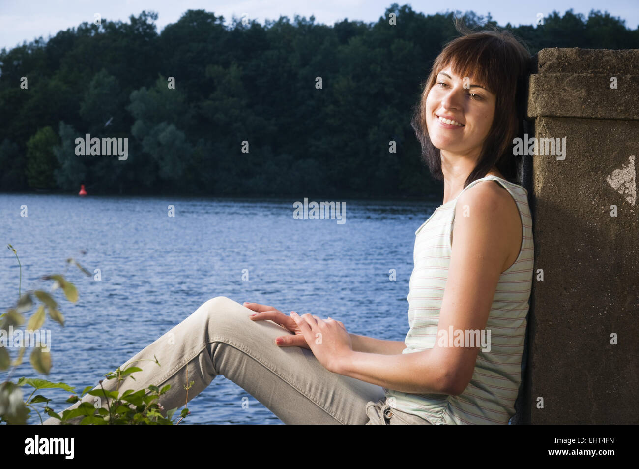 smiling lady by the river Stock Photo - Alamy