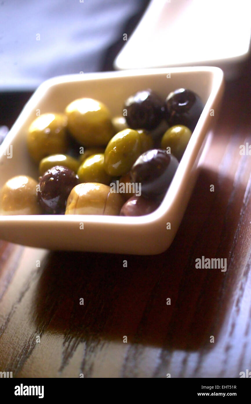 Bowl of olives in a restaurant Stock Photo - Alamy