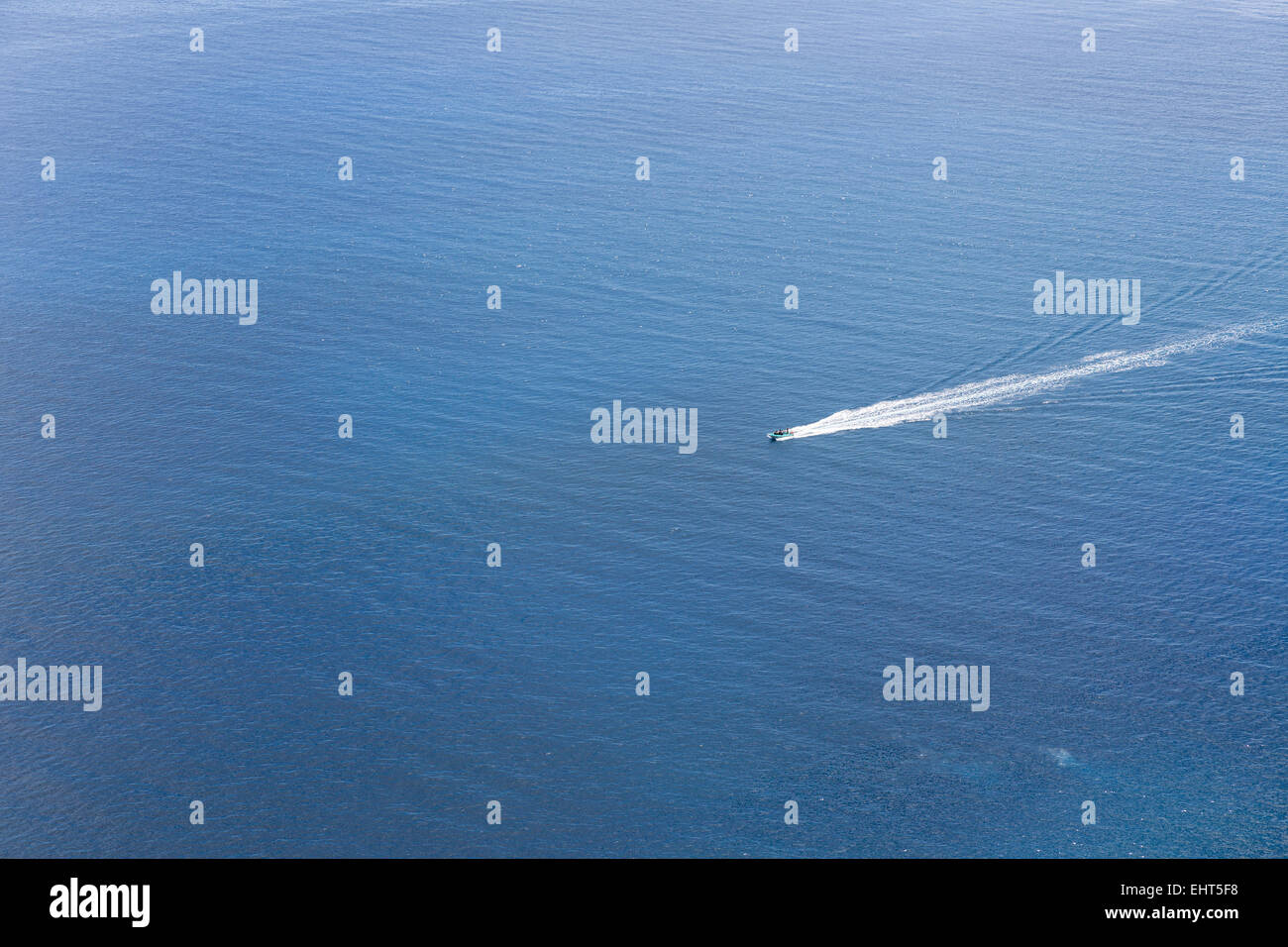 Aerial view of a small ship navigating at an endless blue ocean Stock ...