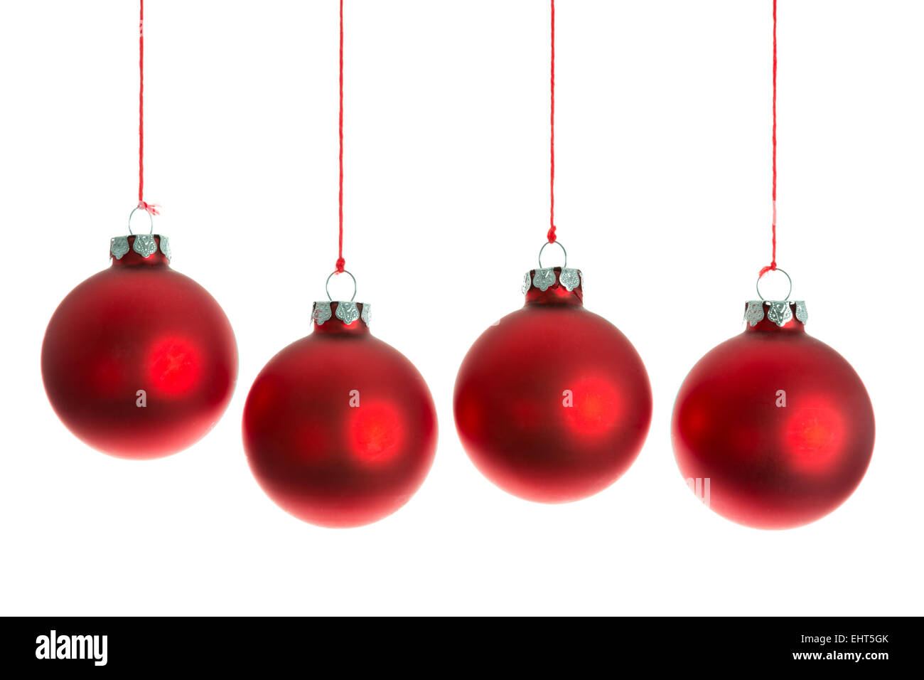 Red Christmas balls hanging at a rope over white Stock Photo - Alamy