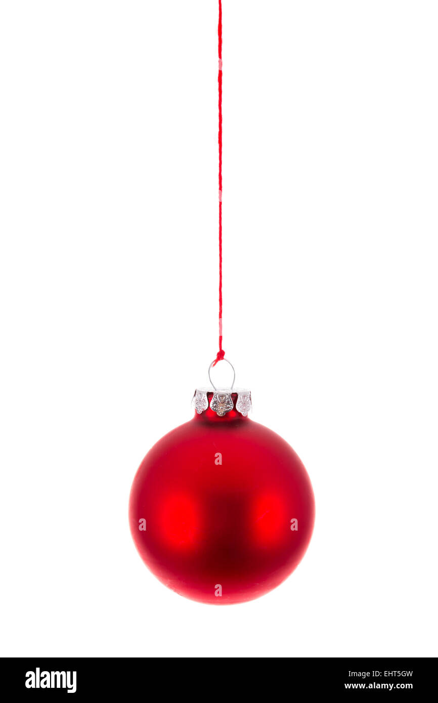 Red Christmas ball hanging at a red rope over white Stock Photo - Alamy