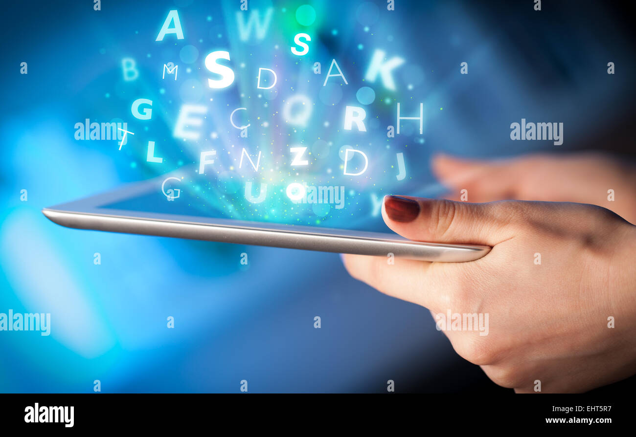 Finger pointing on tablet pc, letters concept Stock Photo - Alamy