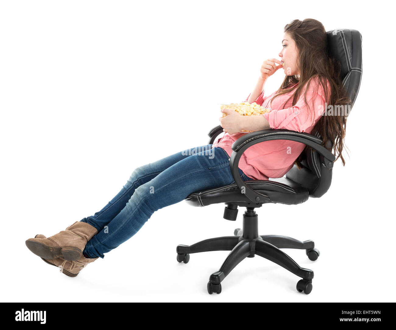 Lazy woman sitting in armchair eating pop corn, isolated at white ...